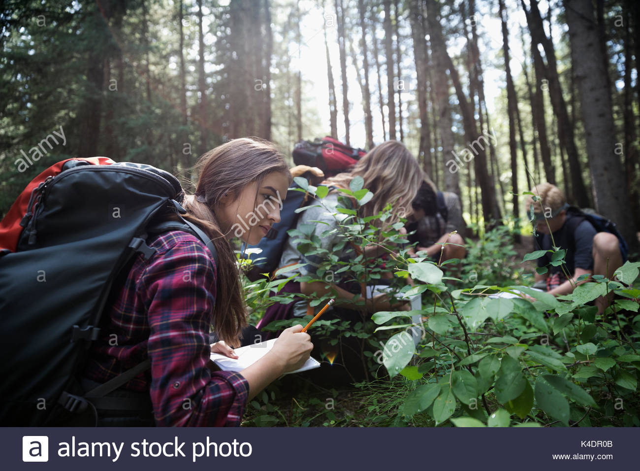 Girl taking notes outdoor hi-res stock photography and images - Alamy