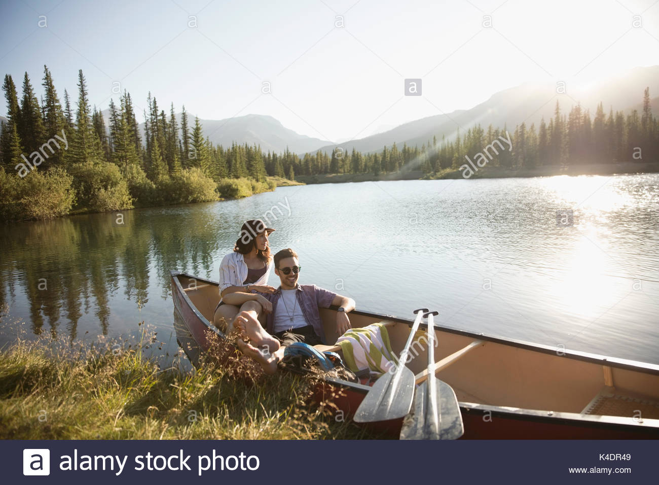 Woman relaxing in canoe hi-res stock photography and images - Alamy