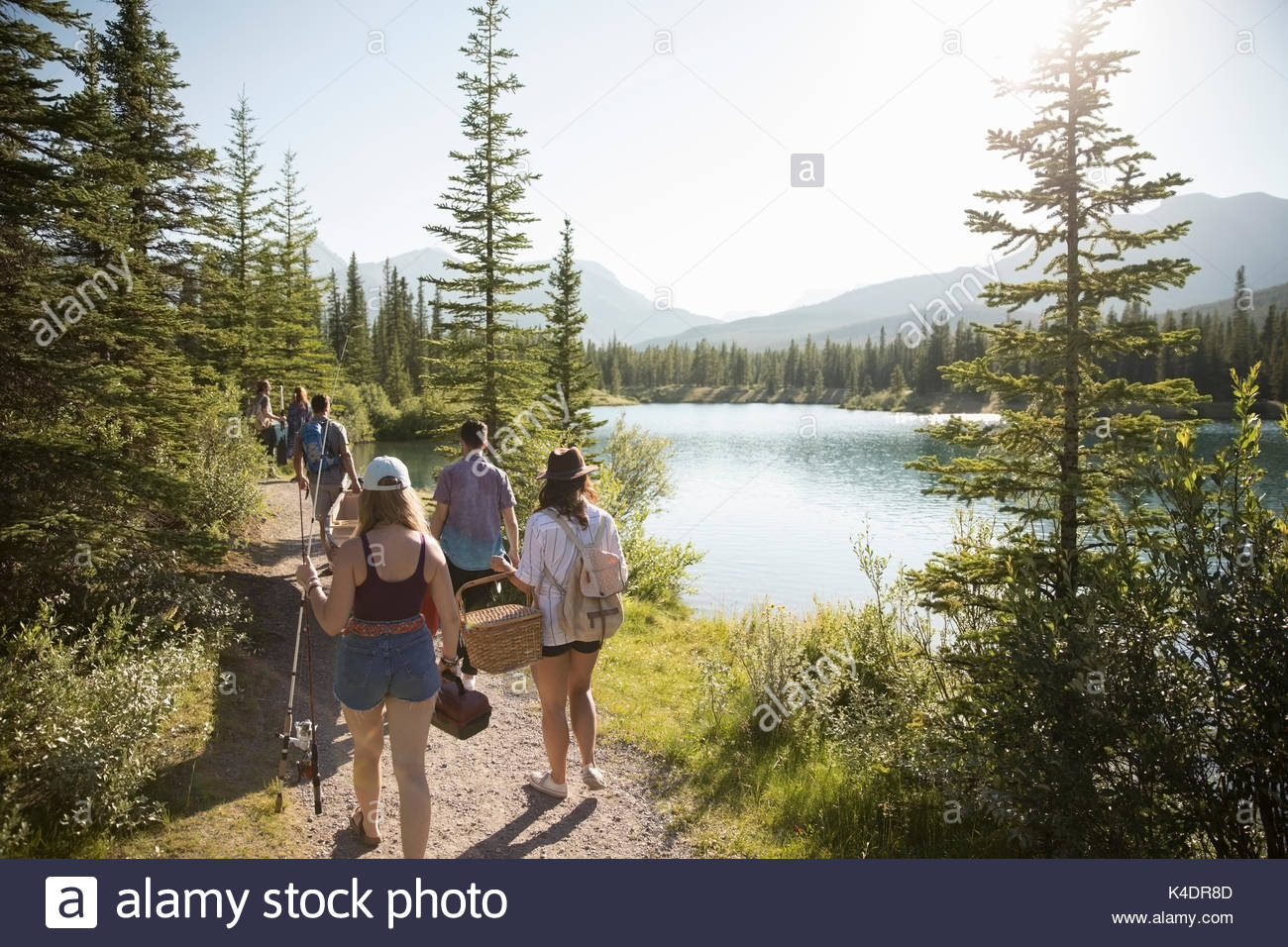 Young woman holding fishing pole hi-res stock photography and images ...