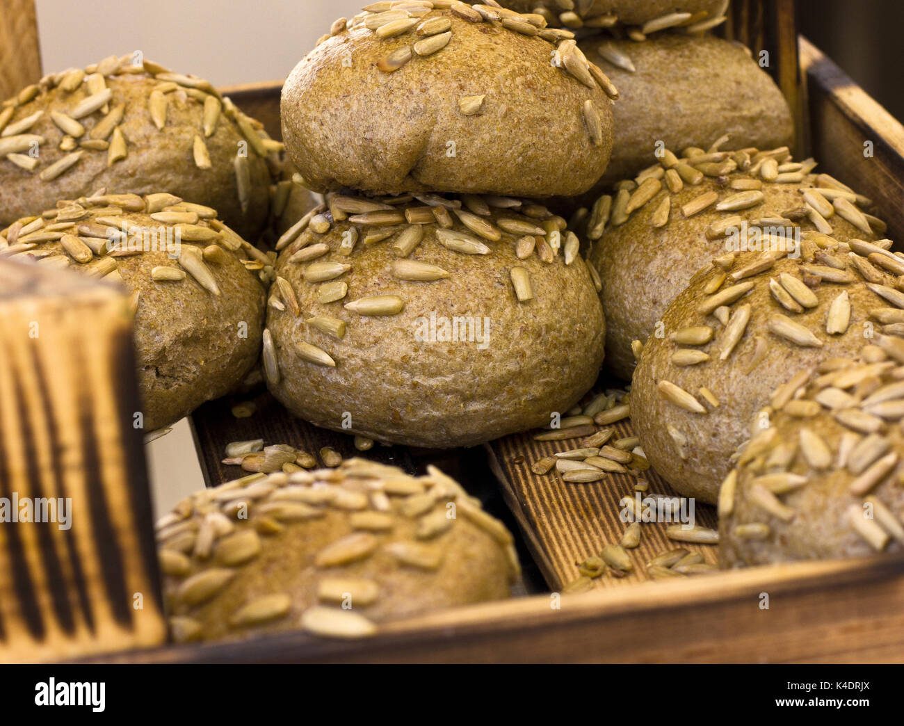 Rye buns with sunflower seeds in wooden box Stock Photo - Alamy