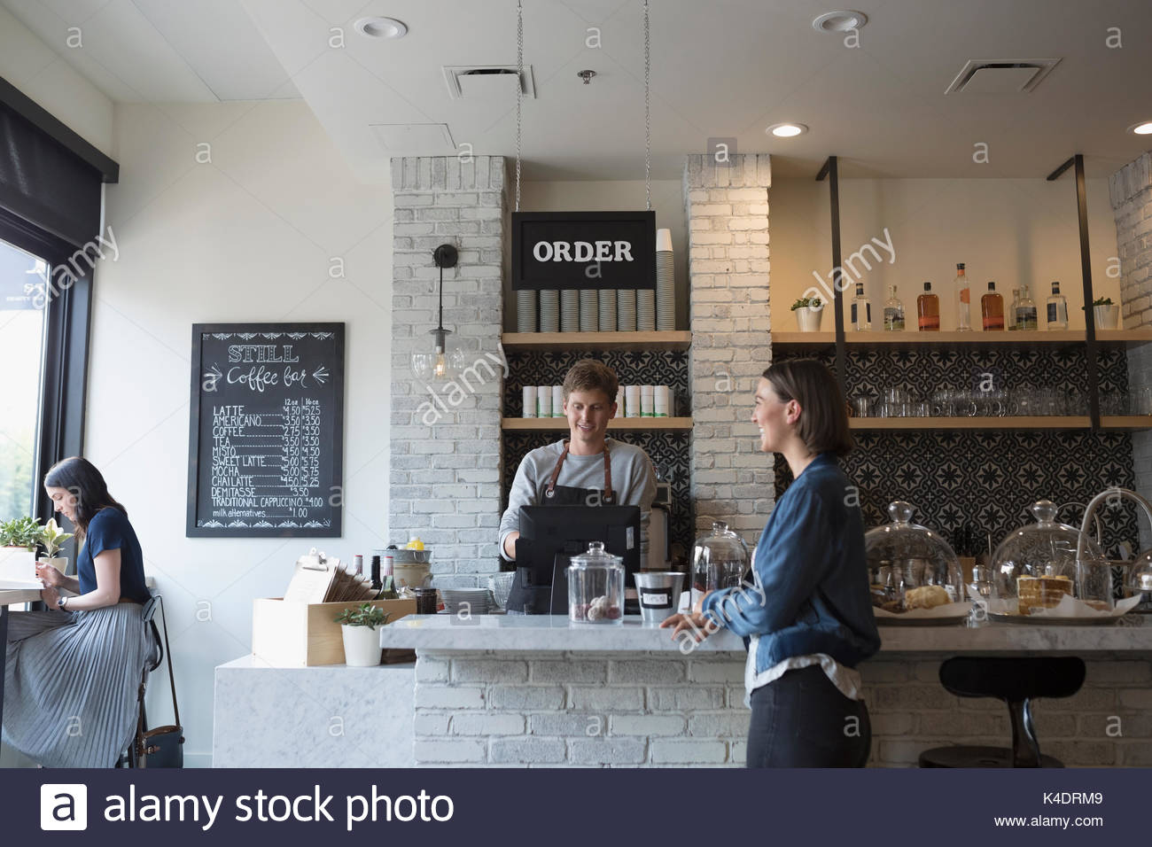 Woman ordering counter hi-res stock photography and images - Alamy