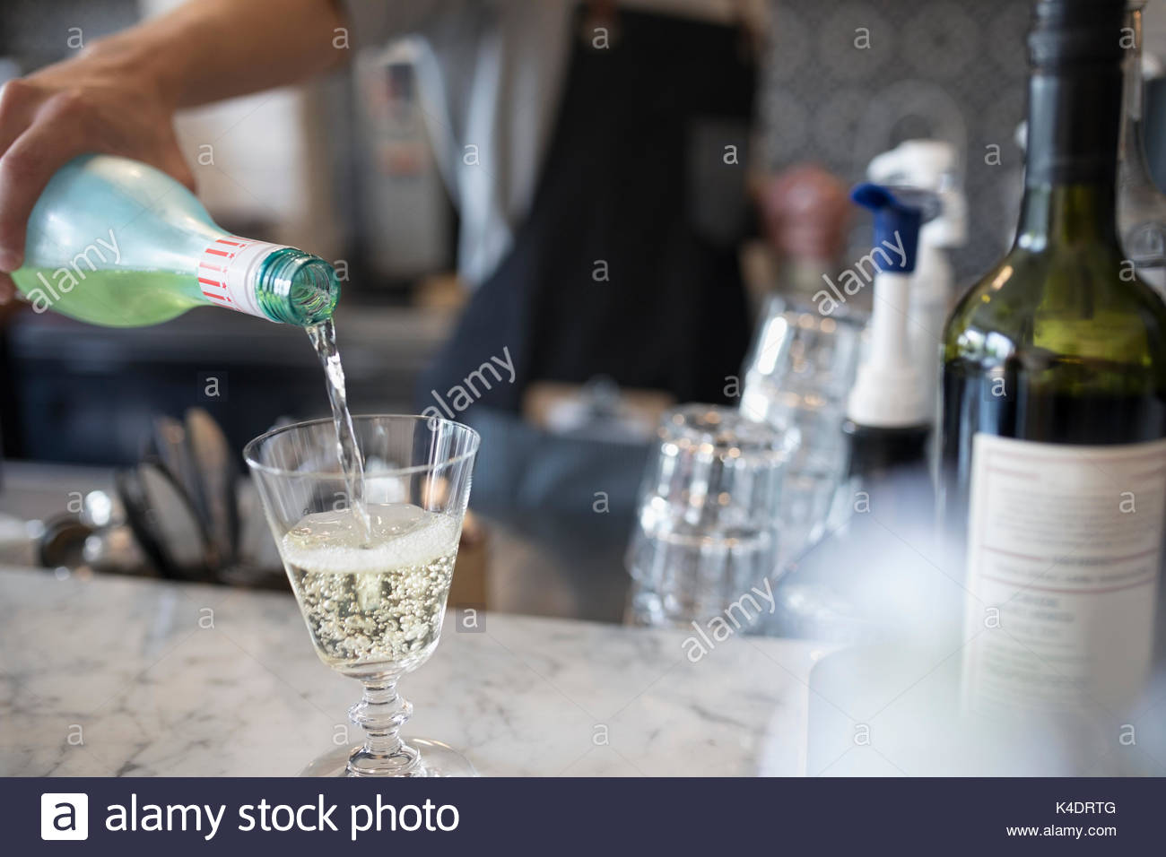 Bartender pouring bottle hi-res stock photography and images - Alamy