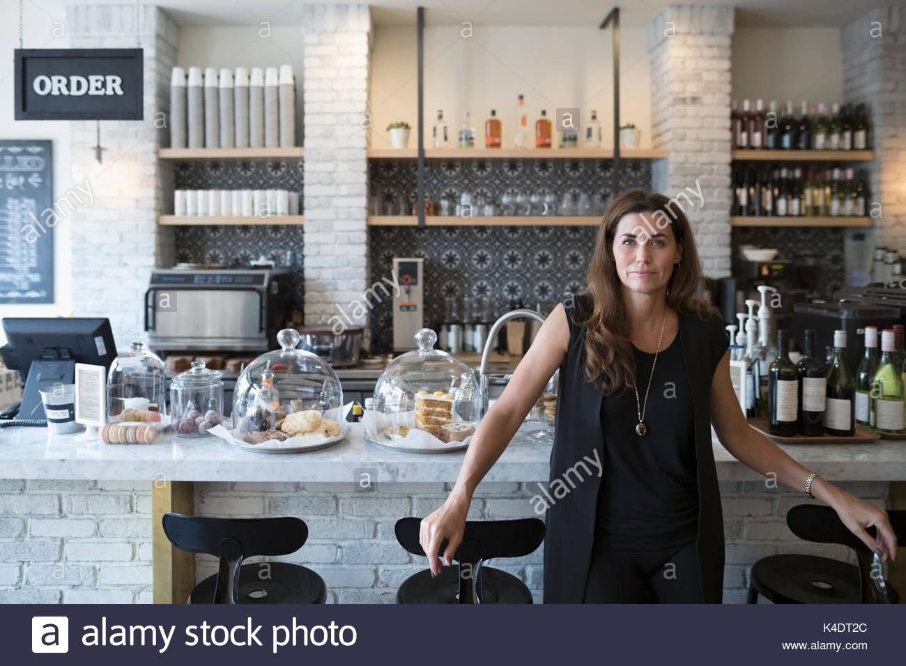 Portrait serious, confident female cafe owner Stock Photo - Alamy Portrait serious, confident female cafe owner Stock Photo - Alamy