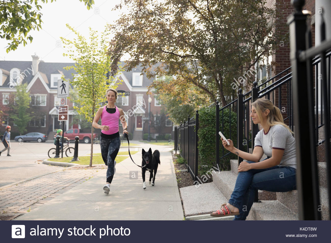 Female runner and sitting and dog hi-res stock photography and images ...
