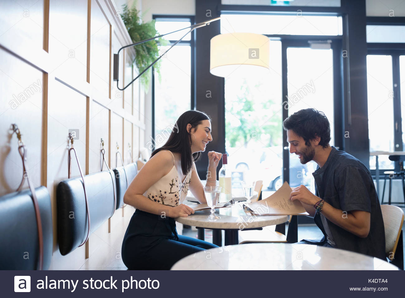 Two people looking at a menu hi-res stock photography and images - Alamy