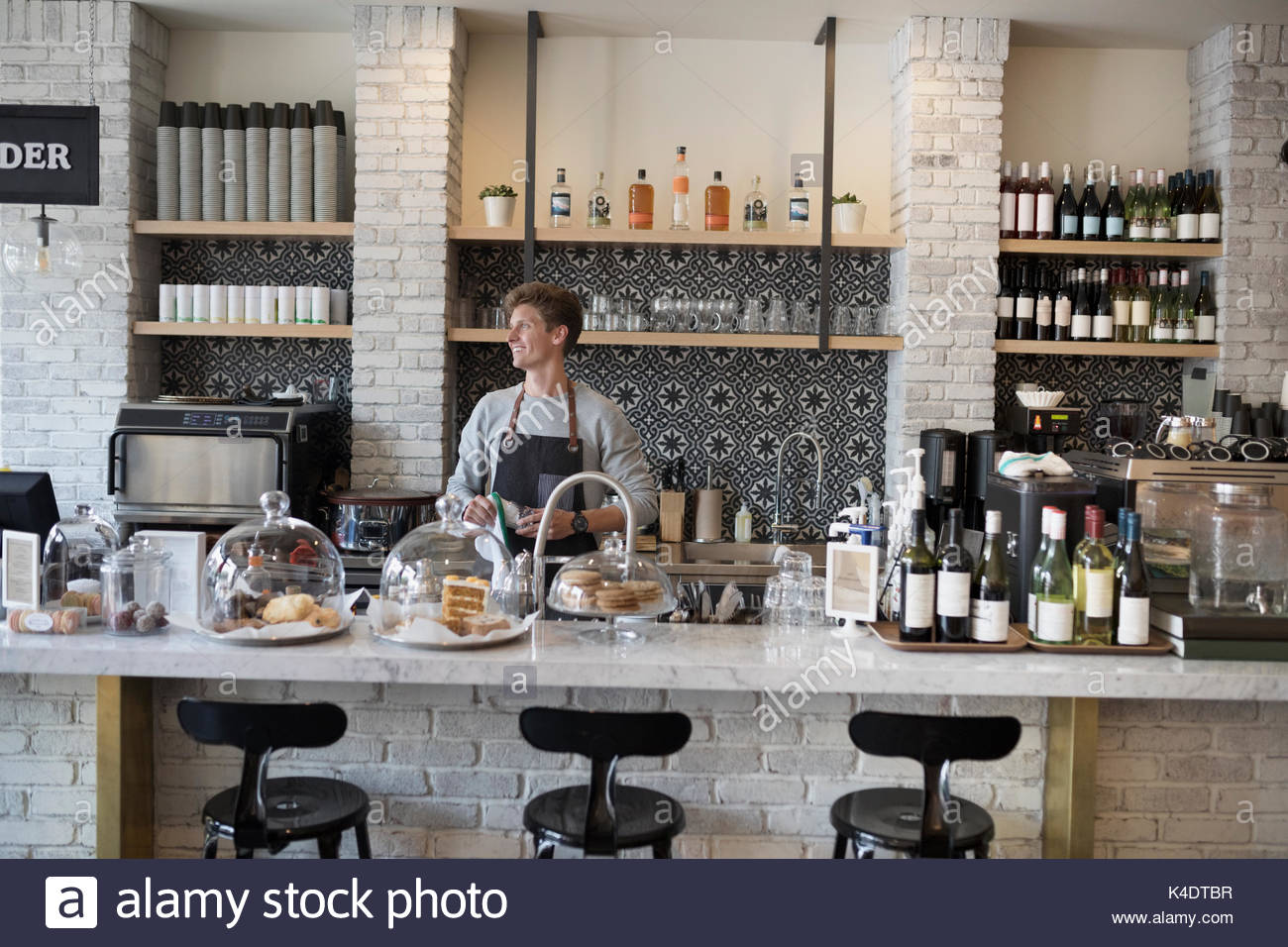 Barista behind cafe counter hi-res stock photography and images - Alamy