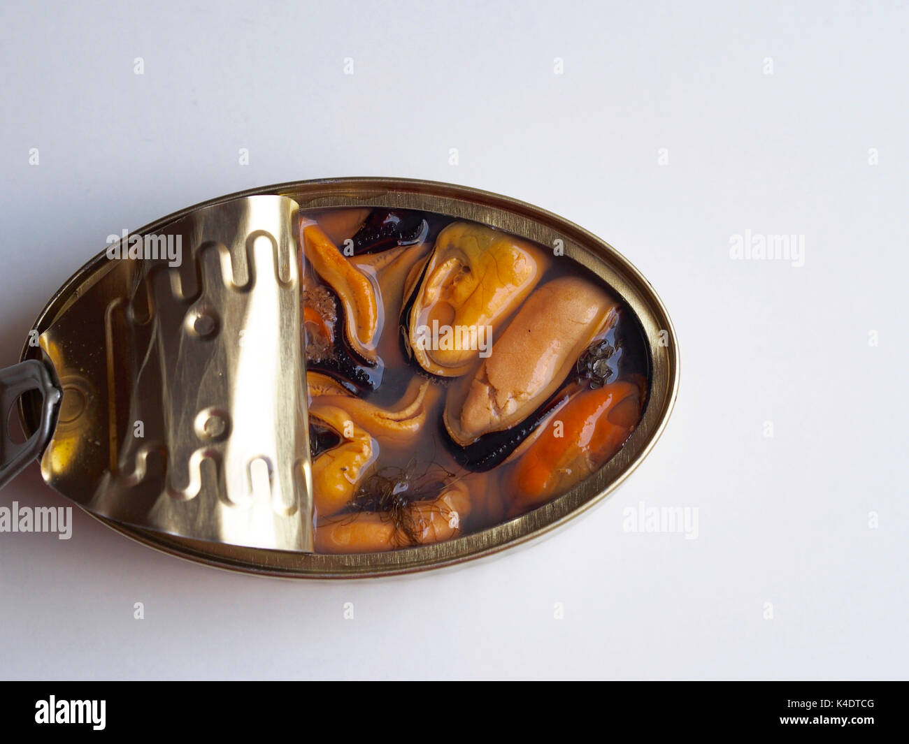 Natural mussels canned on white background Stock Photo - Alamy