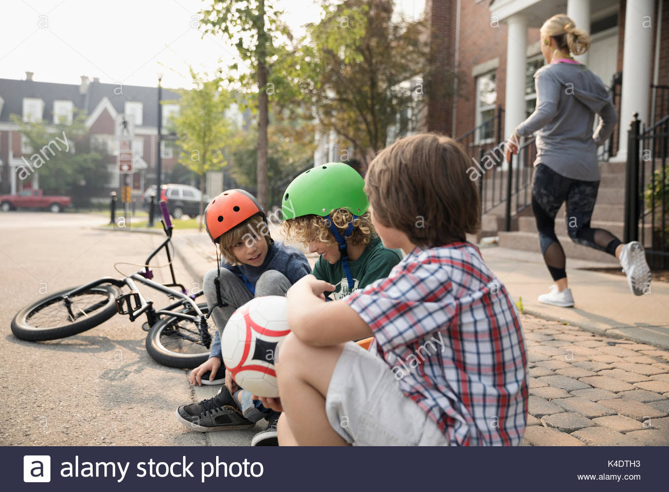 Sitting On Curb Stock Photos & Sitting On Curb Stock Images - Alamy