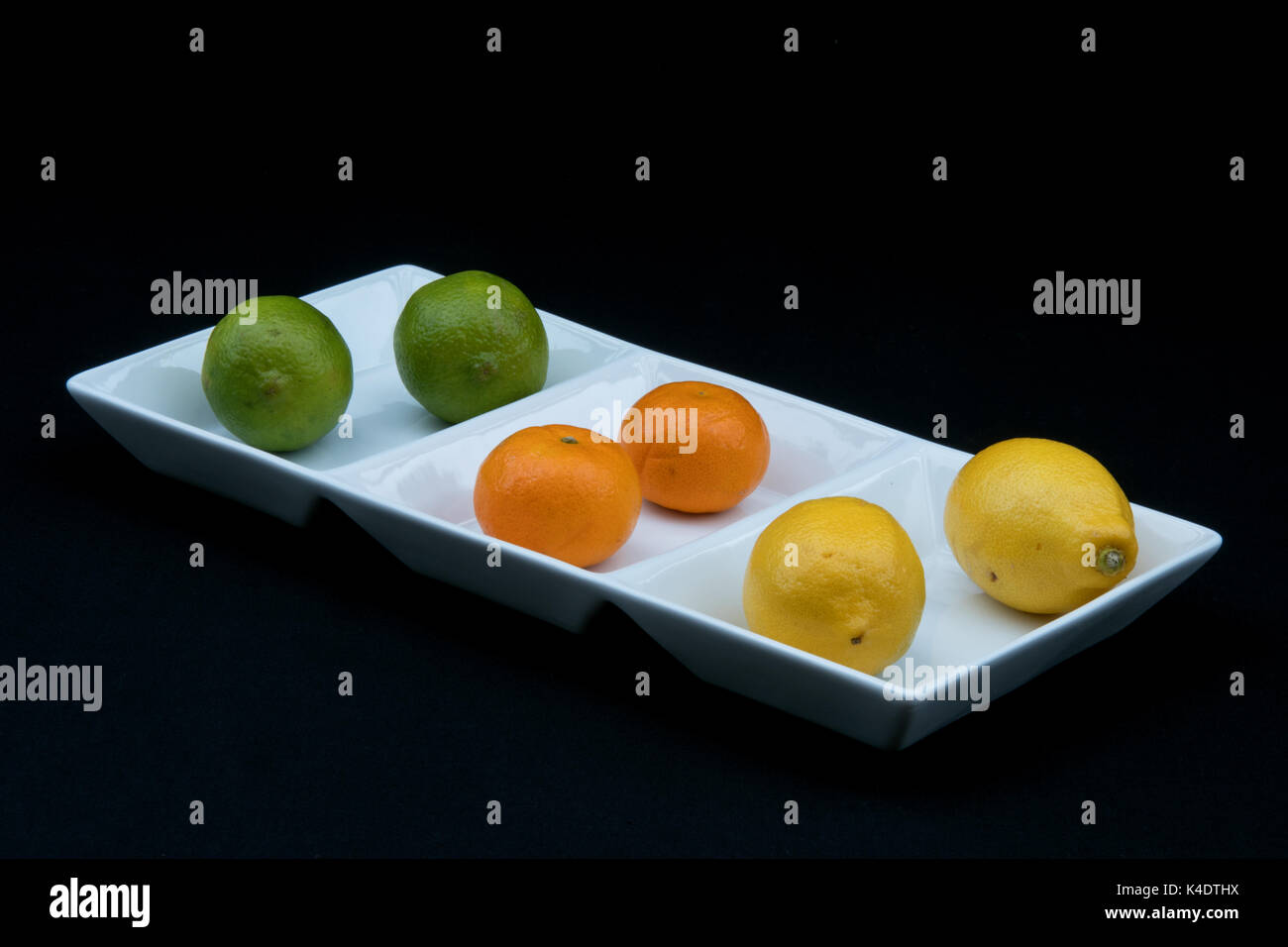 White dish of citrus fruits Stock Photo - Alamy