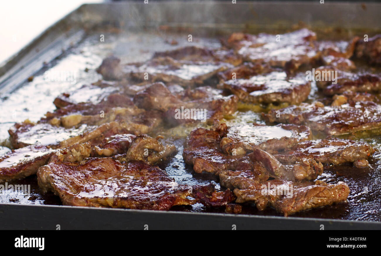Grilling beef meat Stock Photo - Alamy