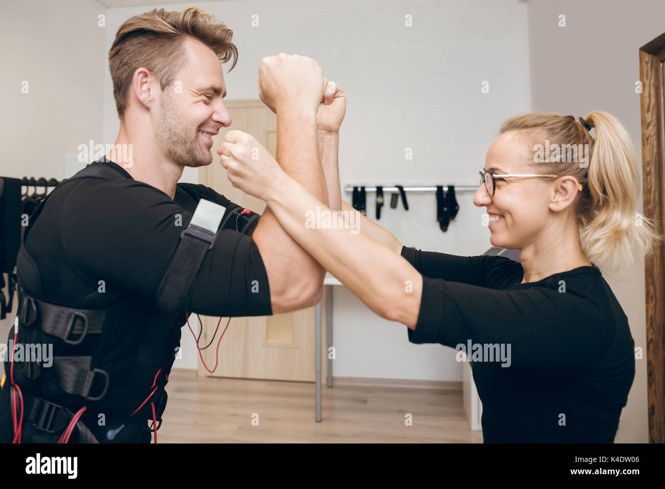 Side portrait of happy man and his coach training together Stock Photo ...