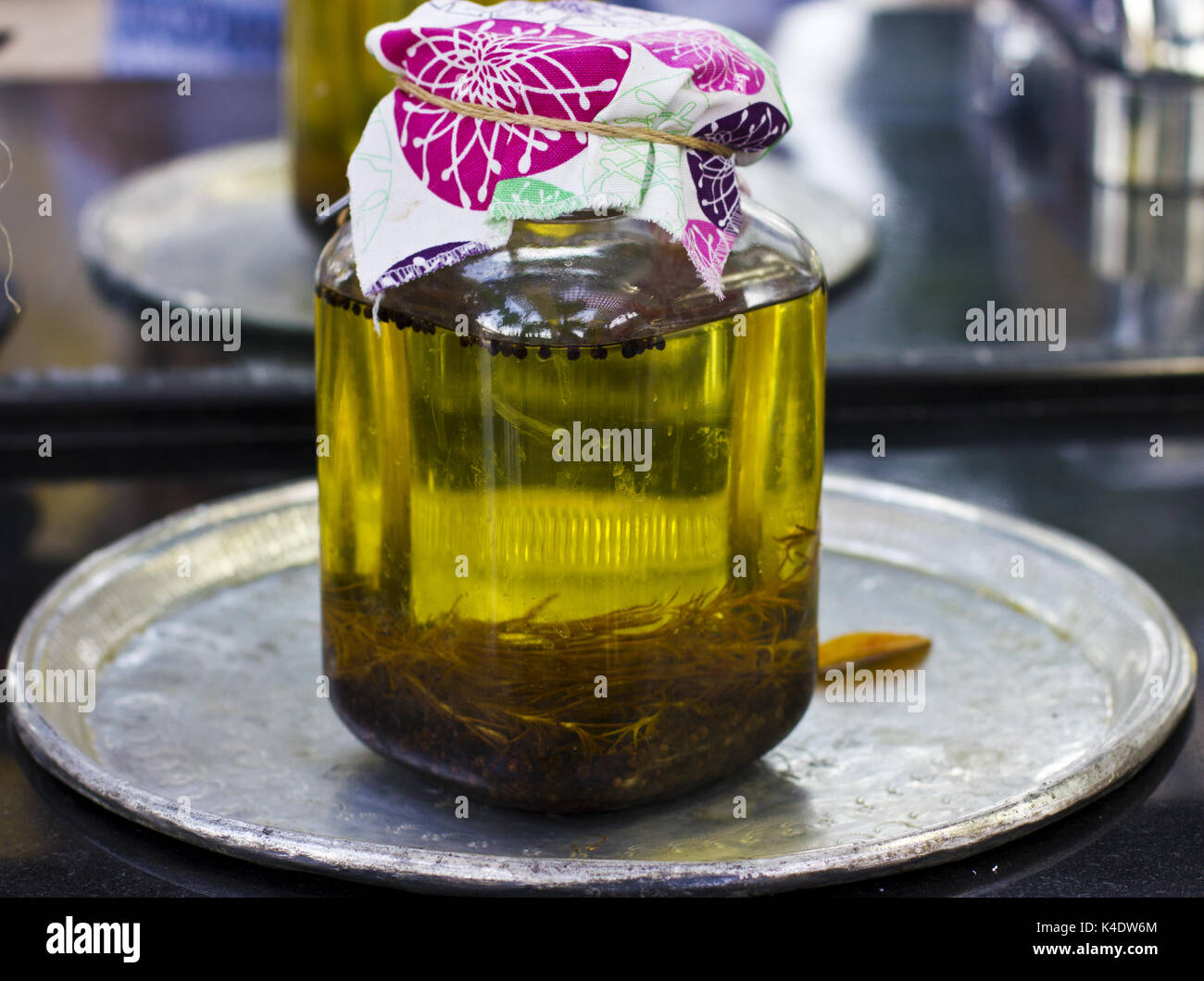 Vegetable oil with spices in the jar Stock Photo - Alamy