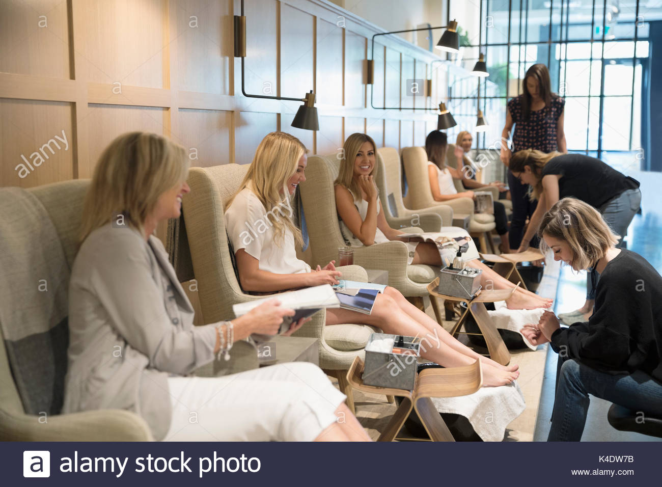Women friends receiving pedicures in nail salon Stock Photo - Alamy