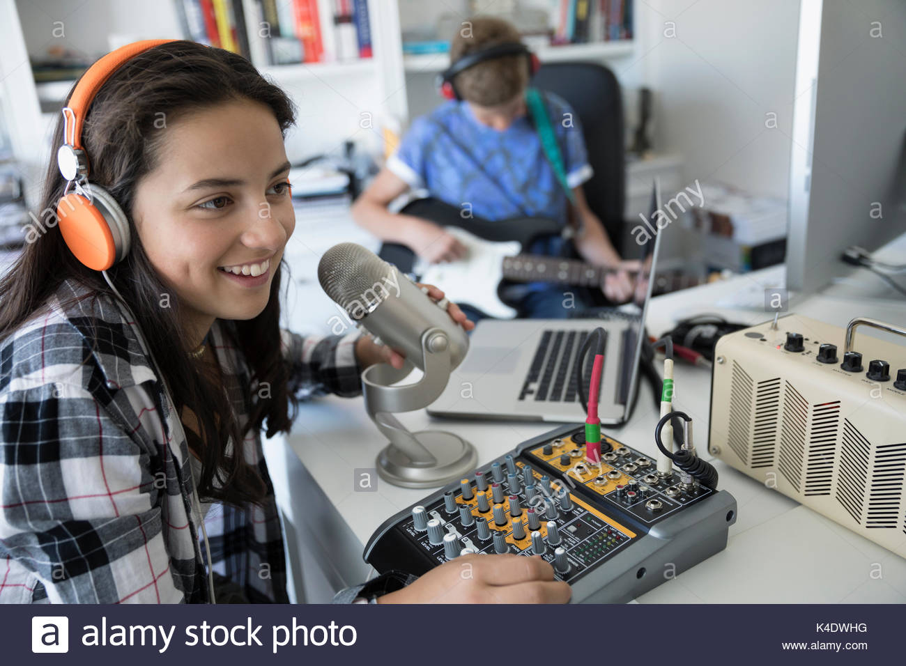 Looking away sitting communication smiling microphone hi-res stock ...