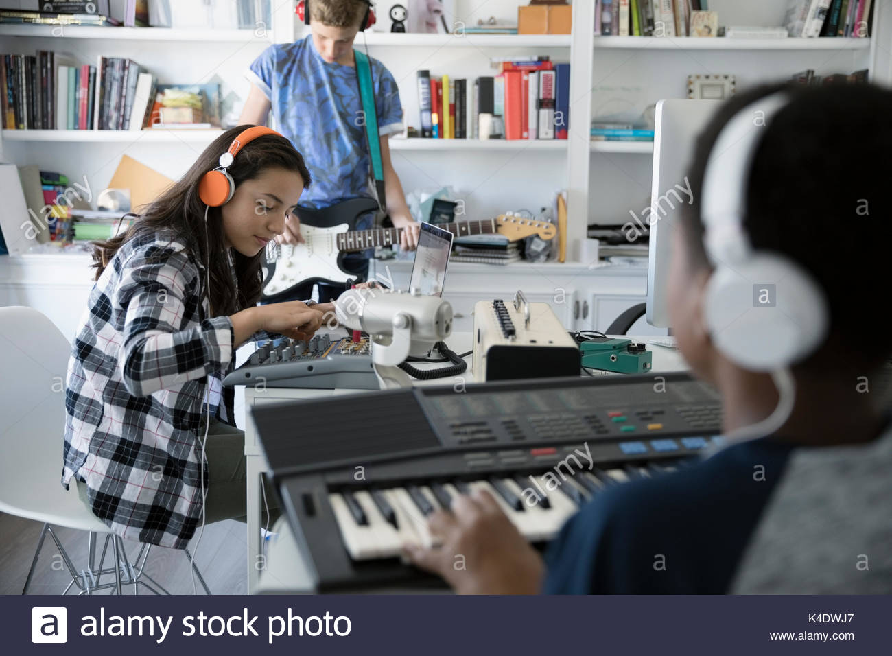 Office girl listening music hi-res stock photography and images - Alamy