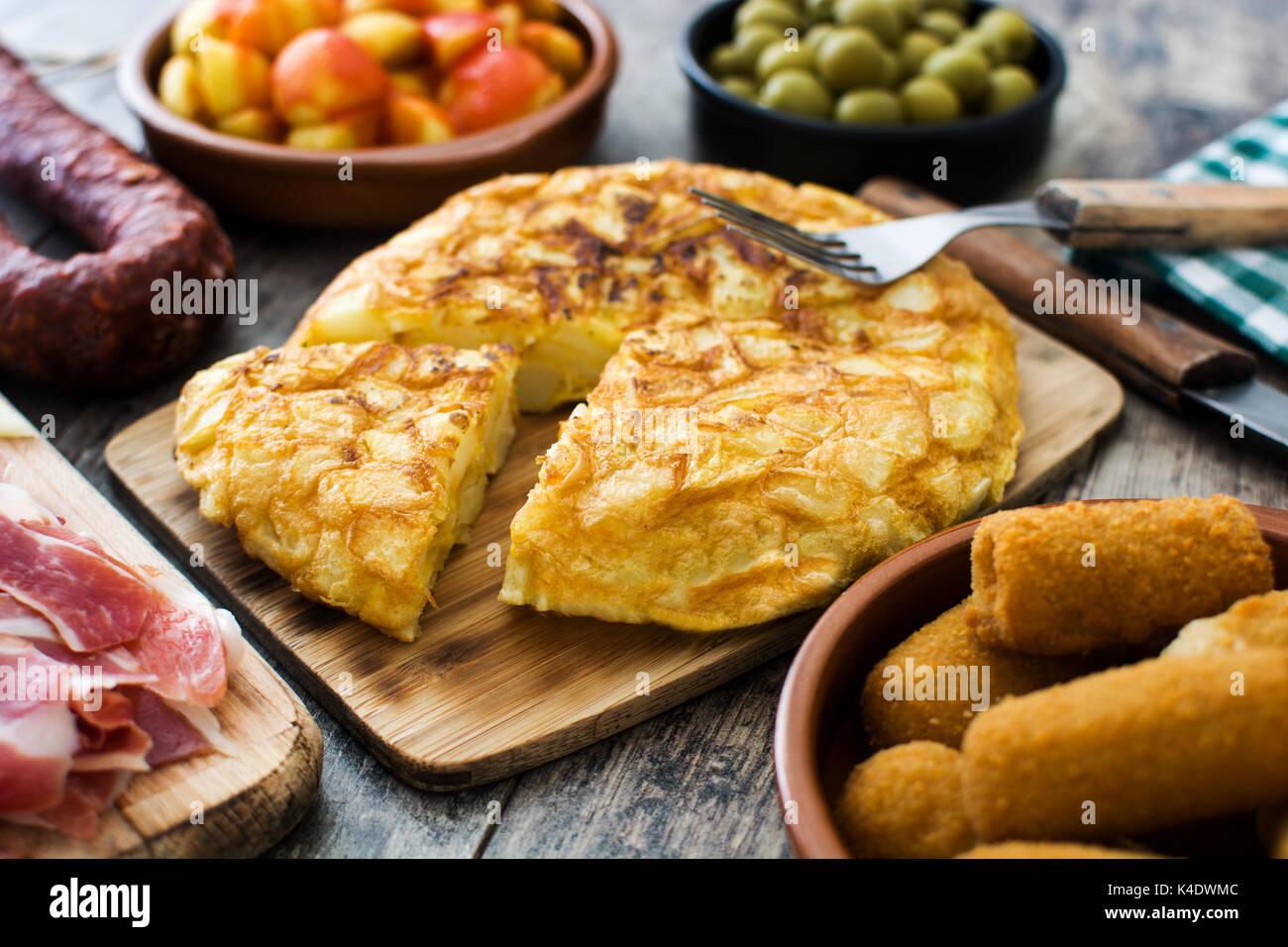 Traditional spanish tapas. Croquettes, olives, omelette, ham and ...