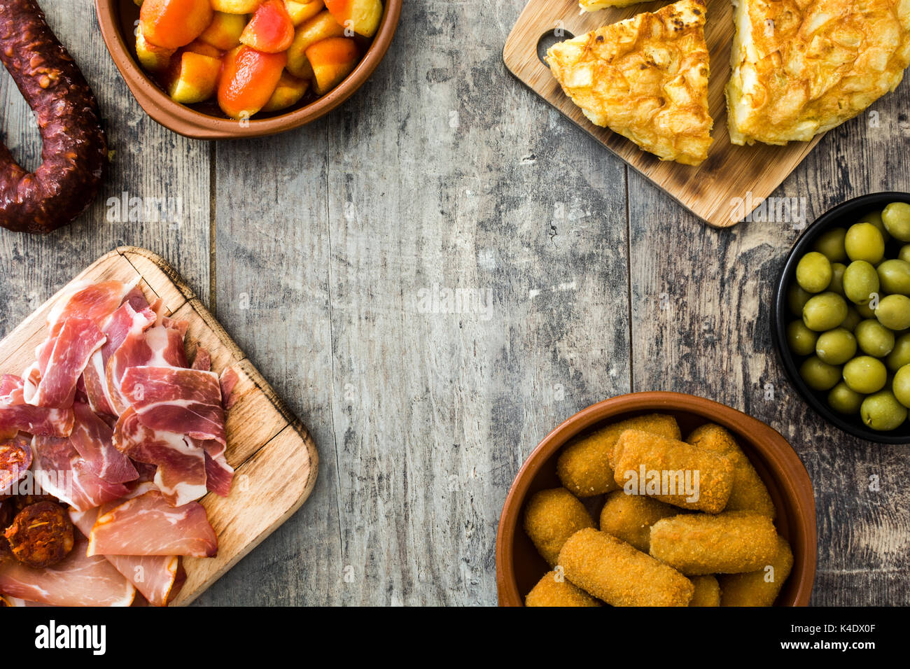 Traditional spanish tapas. Croquettes, olives, omelette, ham and ...