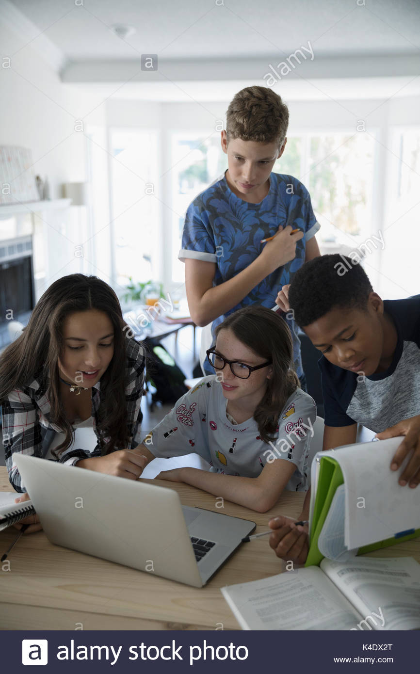 Boy doing homework girl talking hi-res stock photography and images - Alamy