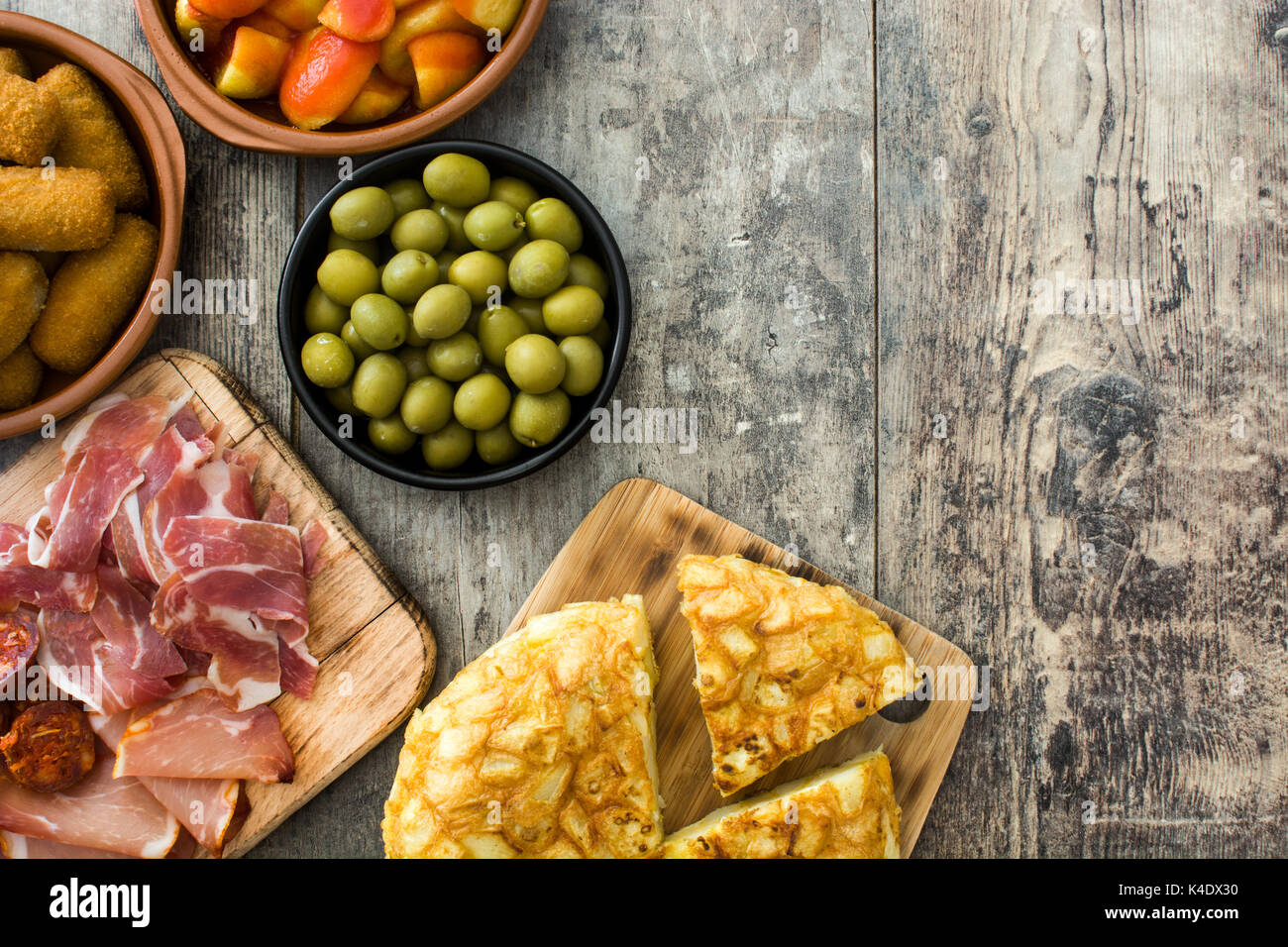 Traditional spanish tapas. Croquettes, olives, omelette, ham and ...