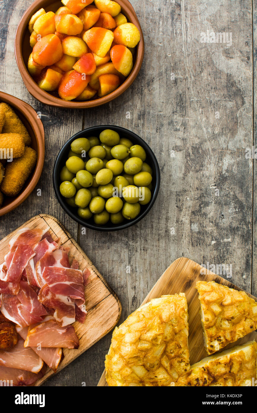 Traditional spanish tapas. Croquettes, olives, omelette, ham and ...