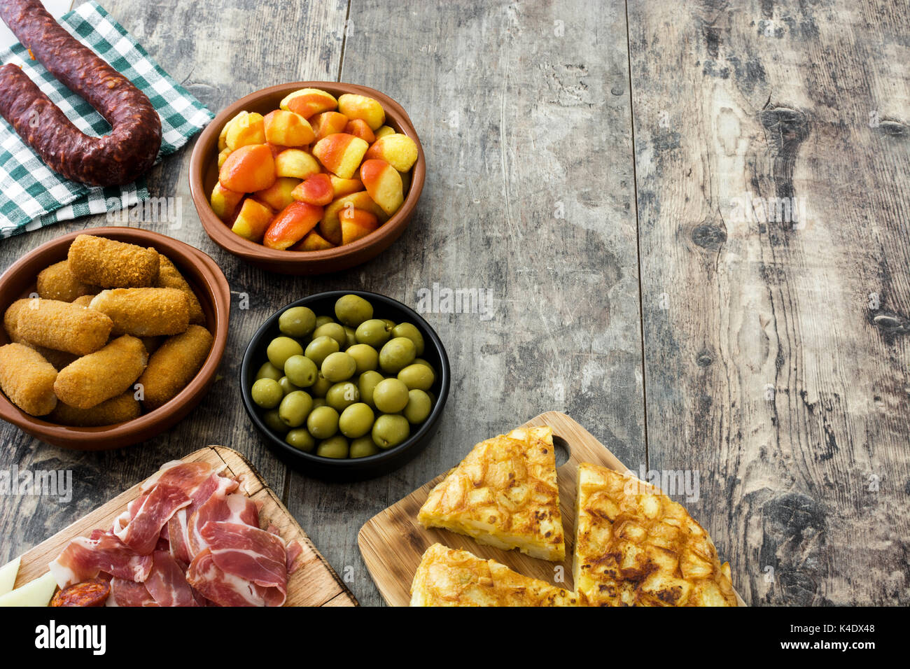 Traditional spanish tapas. Croquettes, olives, omelette, ham and ...
