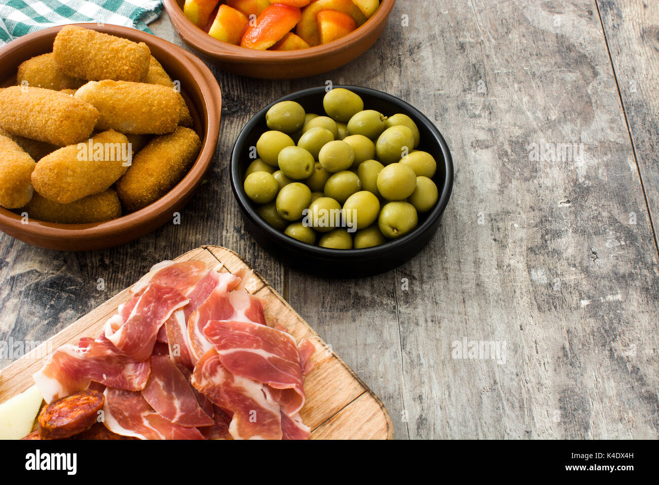 Traditional spanish tapas. Croquettes, olives, omelette, ham and ...