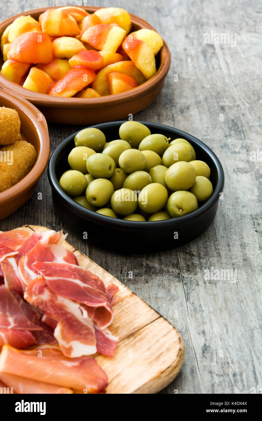 Traditional spanish tapas. Croquettes, olives, omelette, ham and ...