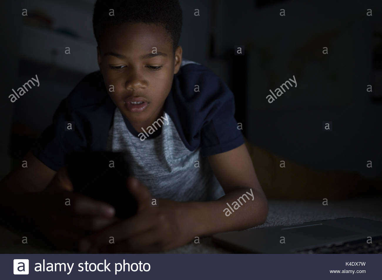 Black boy phone african teenager hi-res stock photography and images ...