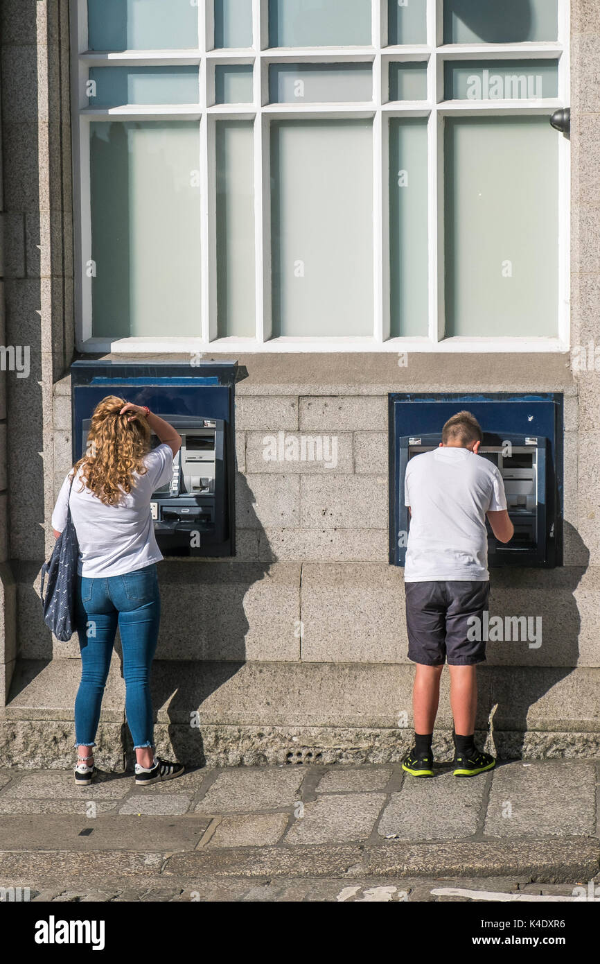 ATM - people using ATM in a city centre Stock Photo - Alamy