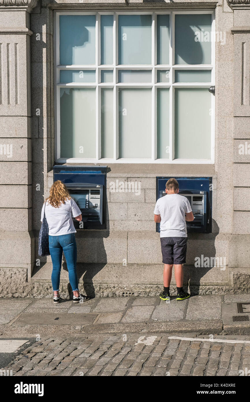 ATM - customers using ATM in a city centre Stock Photo - Alamy