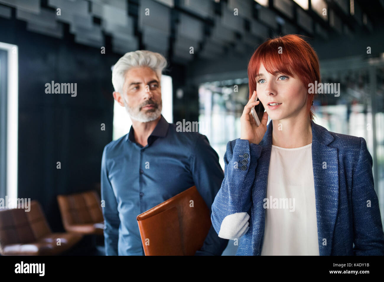 Business people in the office, making a phone call Stock Photo - Alamy