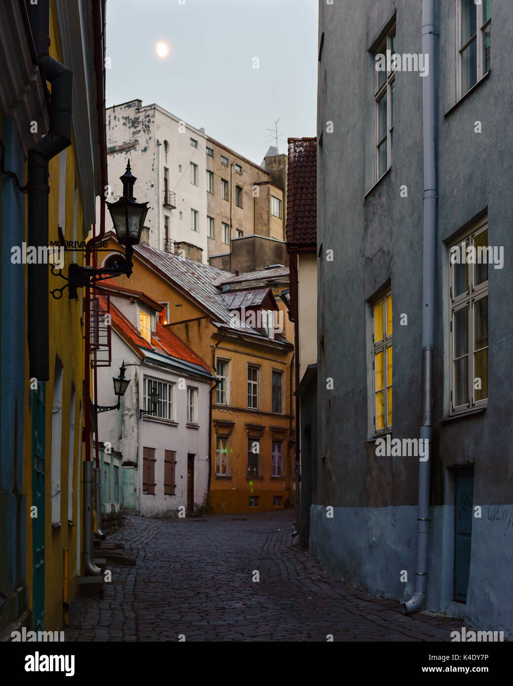 TALLINN, ESTONIA - JUNE 29, 2016: Little street at night with moon ...