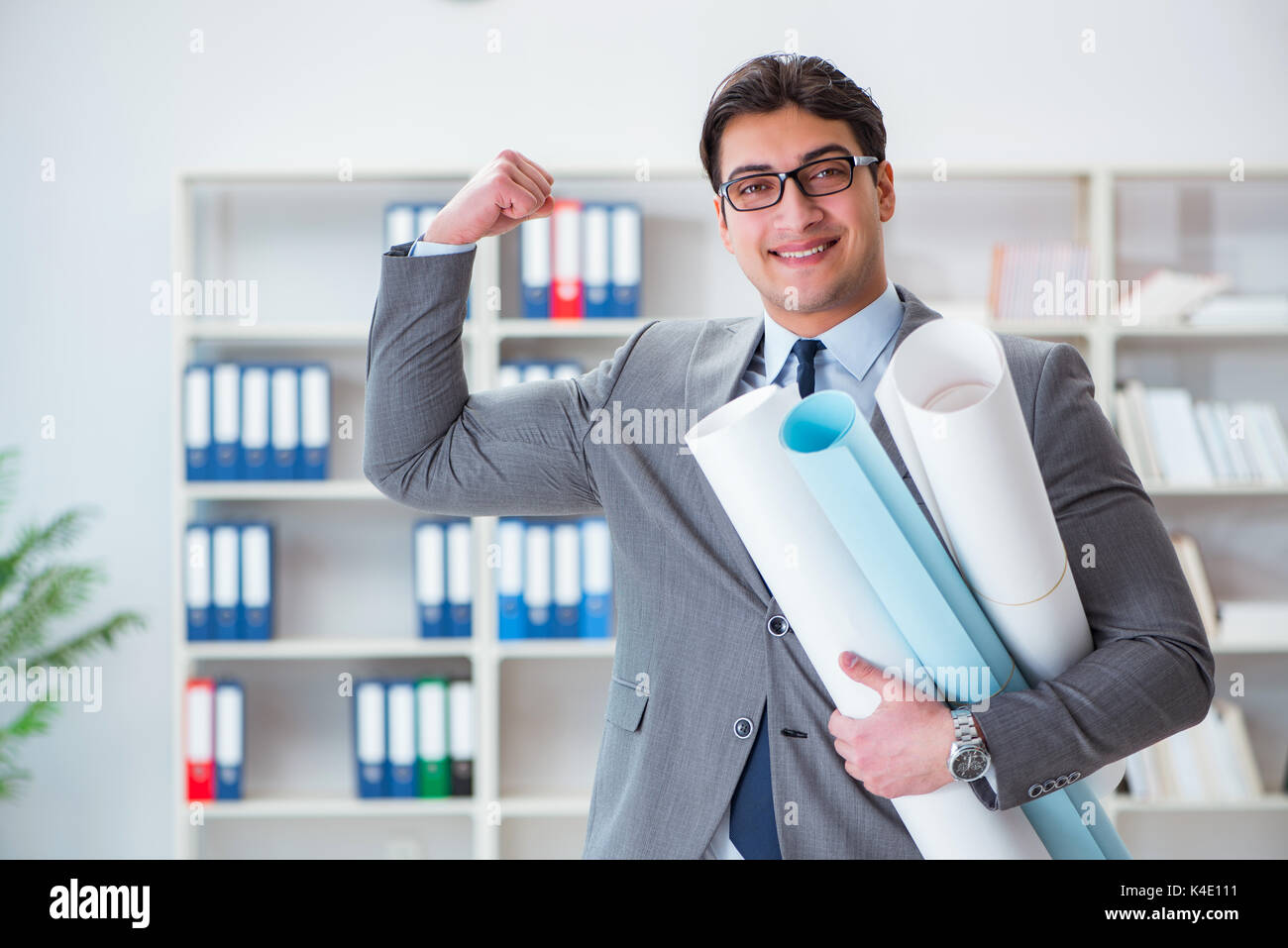Businessman engineer draftsman with blueprints drawings Stock Photo - Alamy