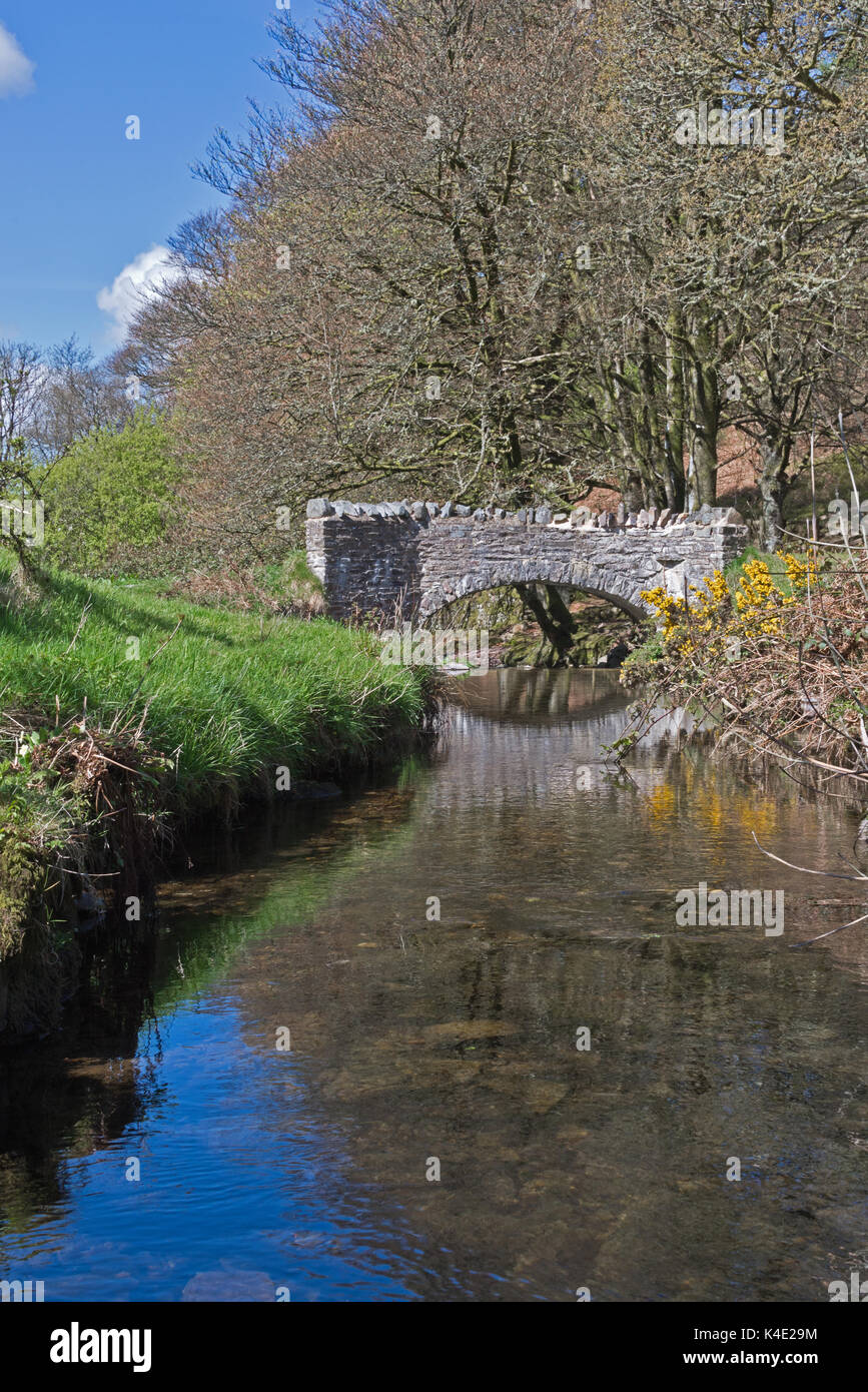 A picture of the ancient granite built Robbers Bridge over Weir Water ...