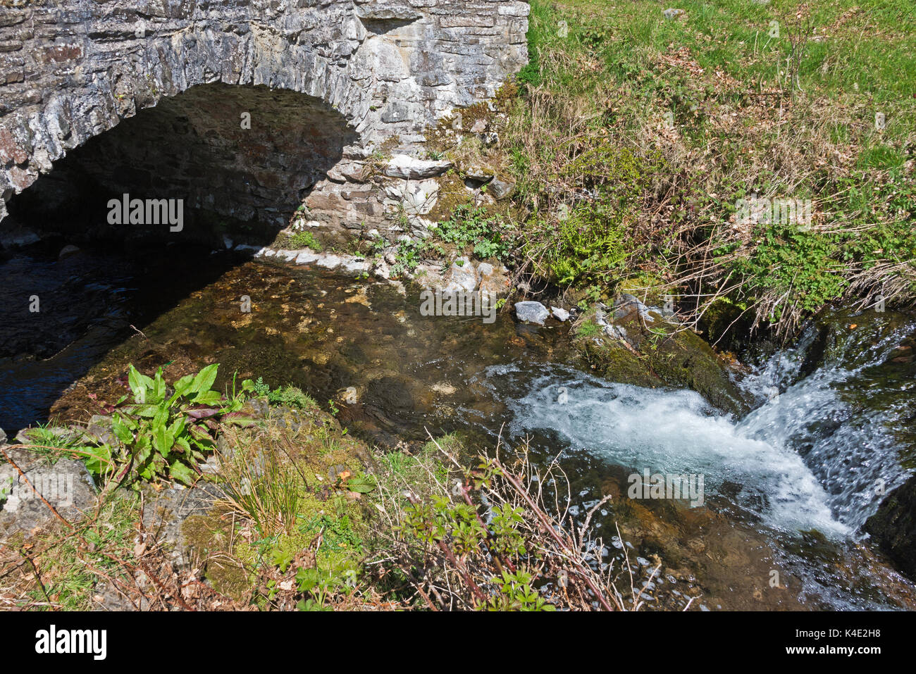 A picture of the ancient granite built Robbers Bridge over Weir Water ...