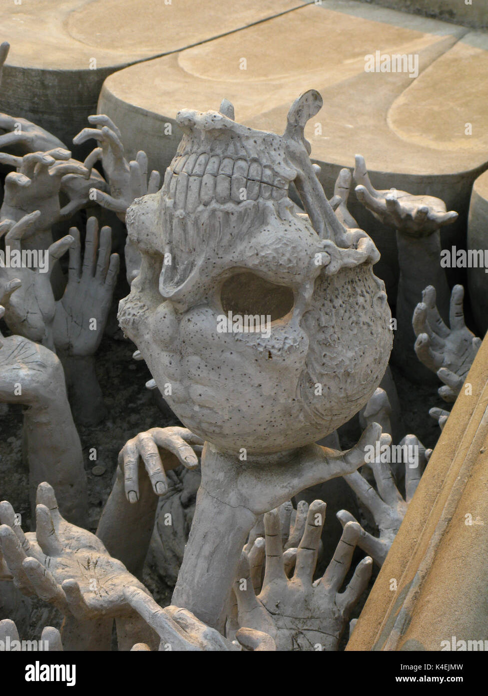 Wat Rongkhun (White temple). Part of the sculpture. Inverted human ...