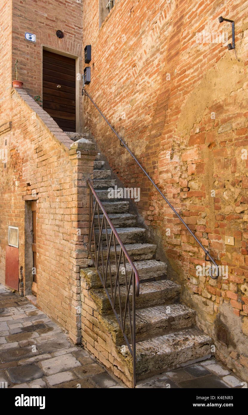 Stone steps leading to an apartment in the historic old town on a sunny ...