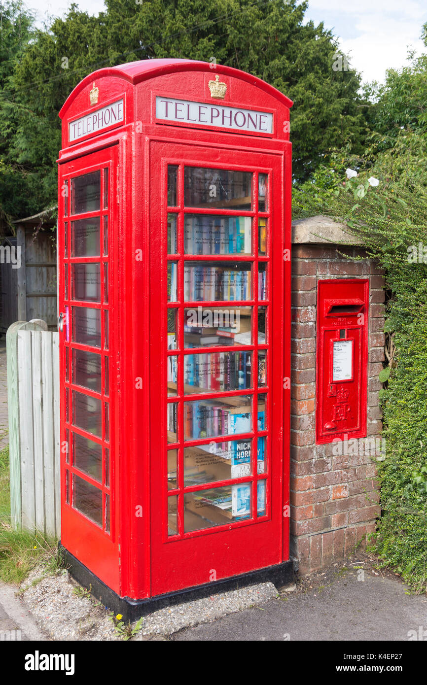 Red telephone kiosk (book exchange) and post box, Chapel Row Stores ...