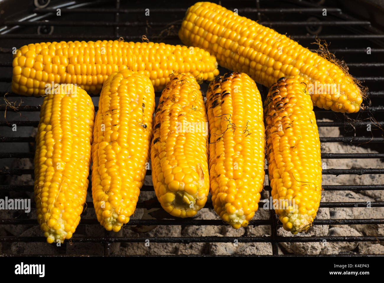 Sweet corn on charcoal barbeque Stock Photo - Alamy