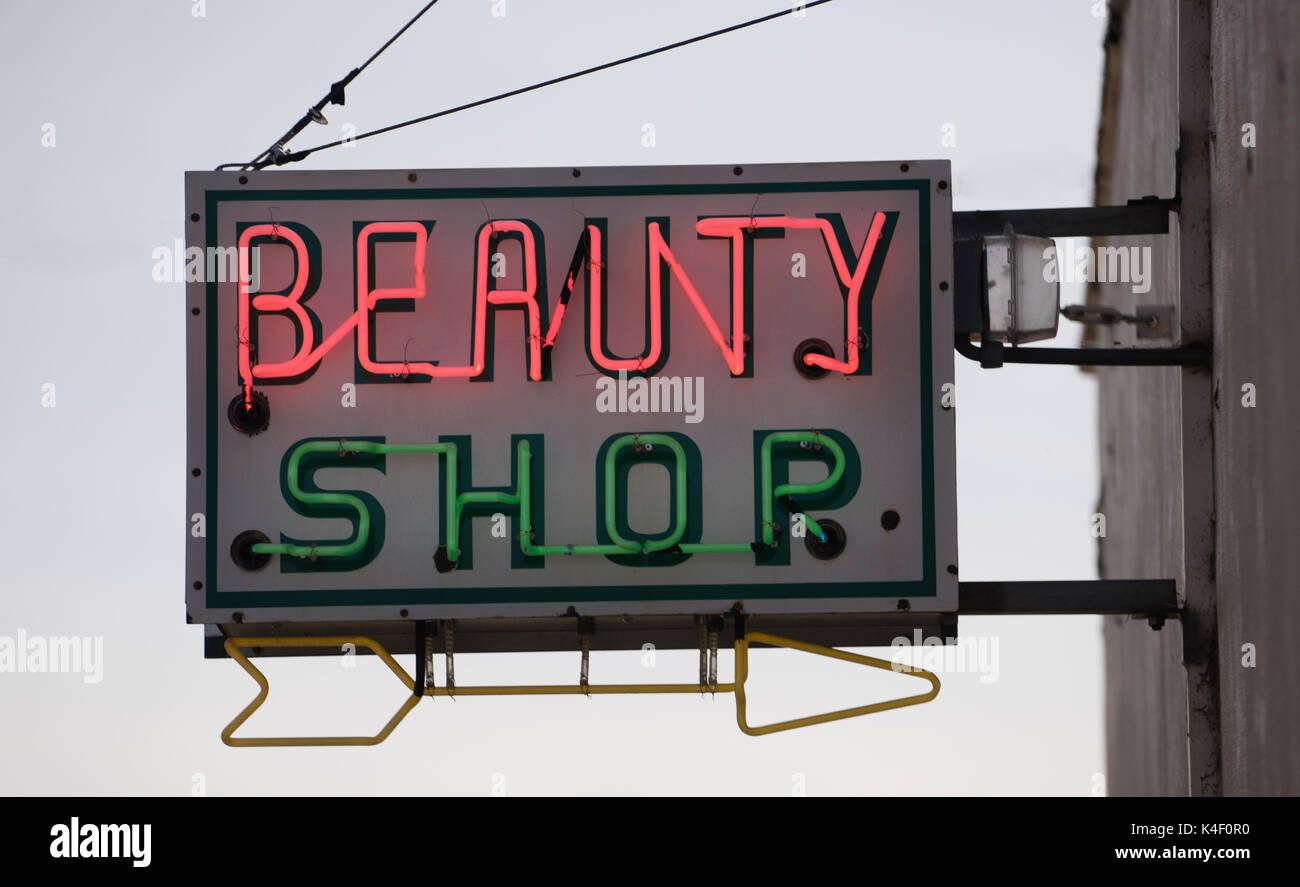 The beauty palor is closed but the neon sign is on Stock Photo - Alamy