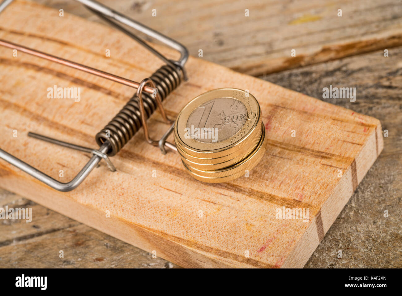 Euro coins on a mouse trap, a financial issues concept Stock Photo - Alamy