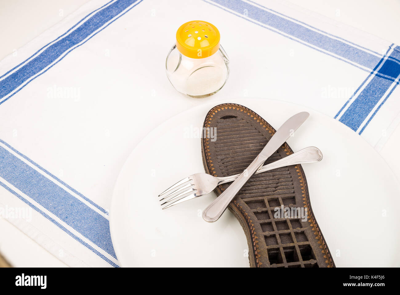 Shoe sole dished, a concept for bad cooking and tough steaks Stock ...