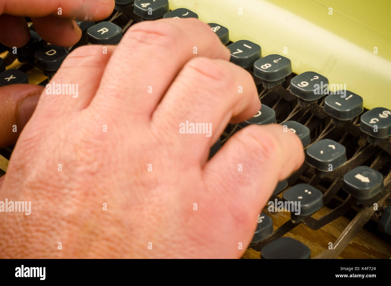 Detail of hands using old typewriter Stock Photo - Alamy