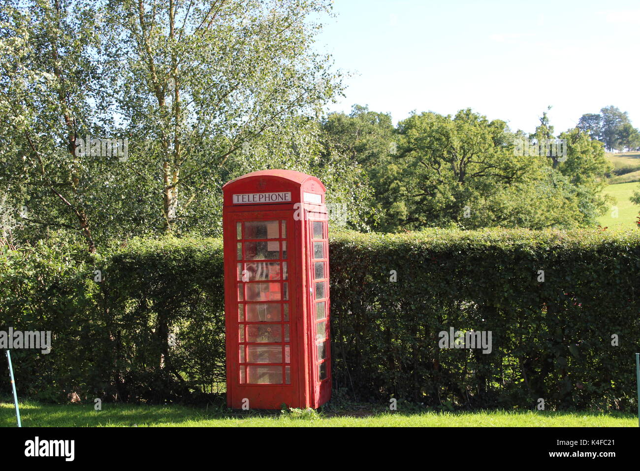 Red telephone box in a country village Stock Photo - Alamy
