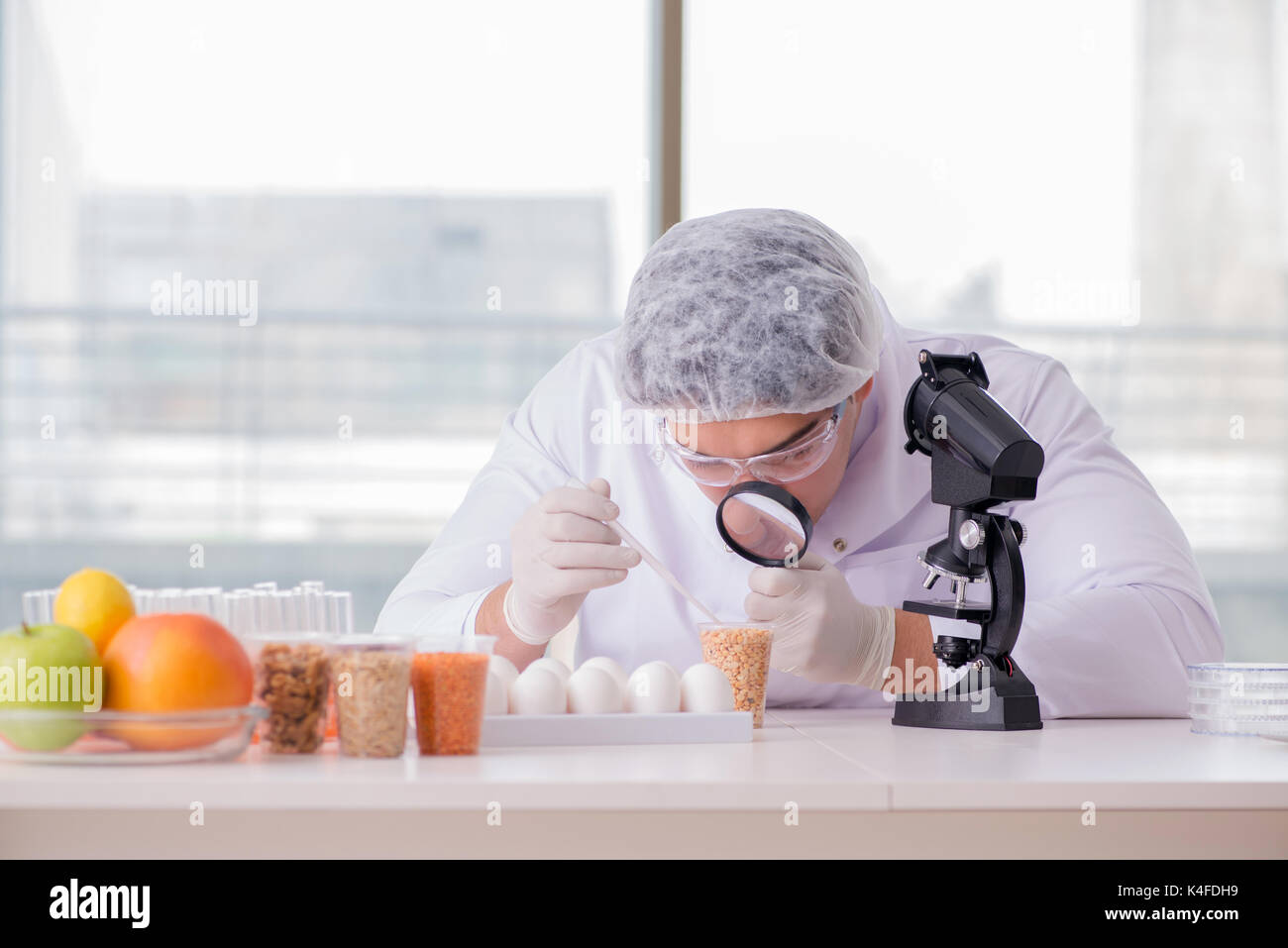 Nutrition expert testing food products in lab Stock Photo - Alamy