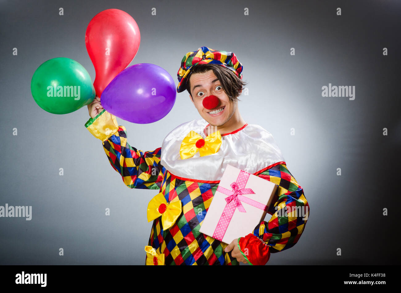 Funny clown in comical concept Stock Photo - Alamy