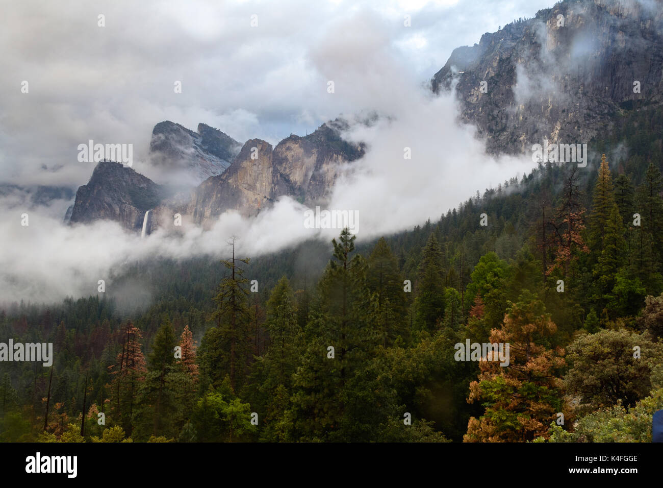 Cloudy / foggy view of Half Dome, Bridal Veil Falls and El Capitan from ...