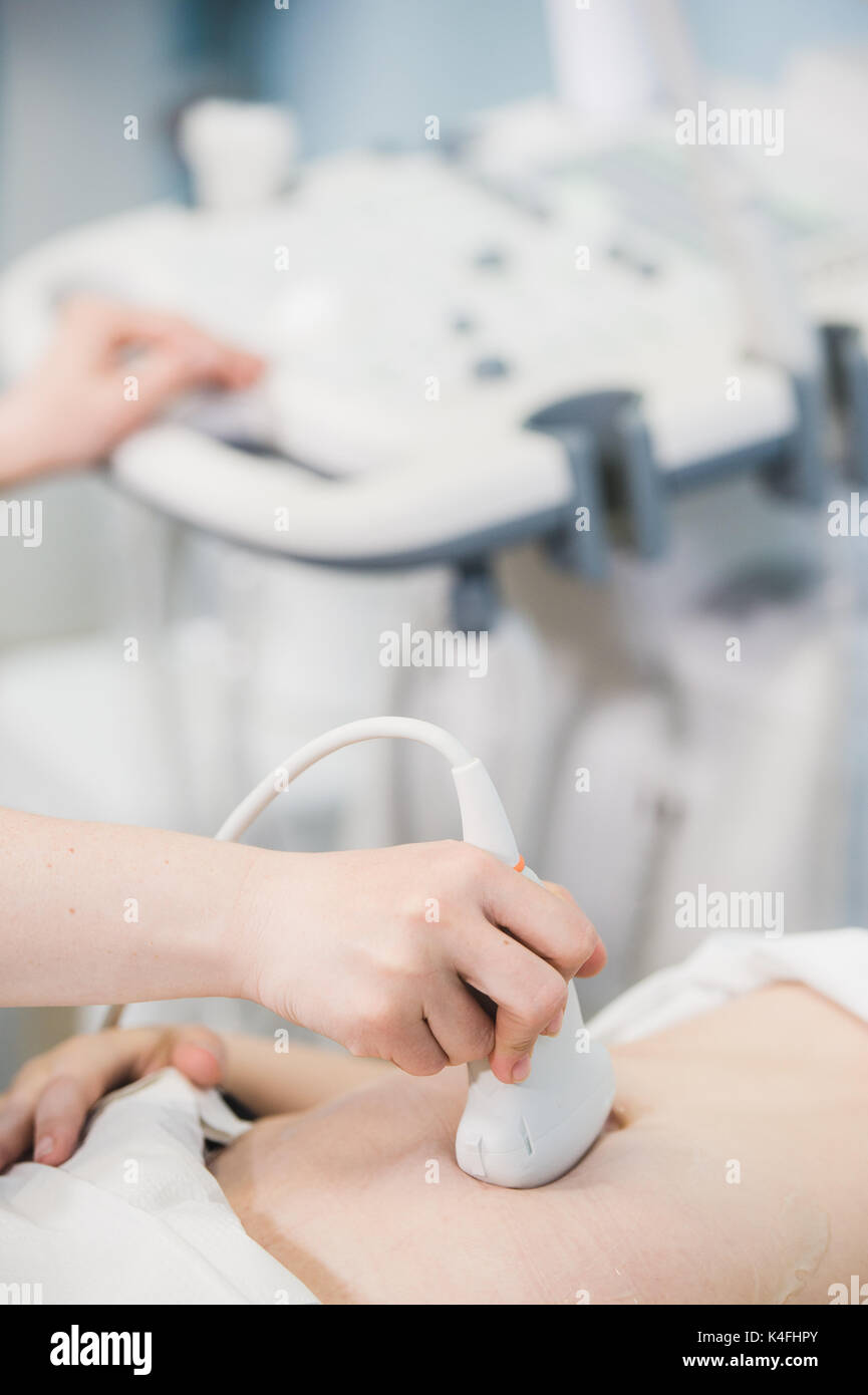 Close-up Of Doctor Moving Ultrasound Probe On Pregnant Woman's Stomach ...