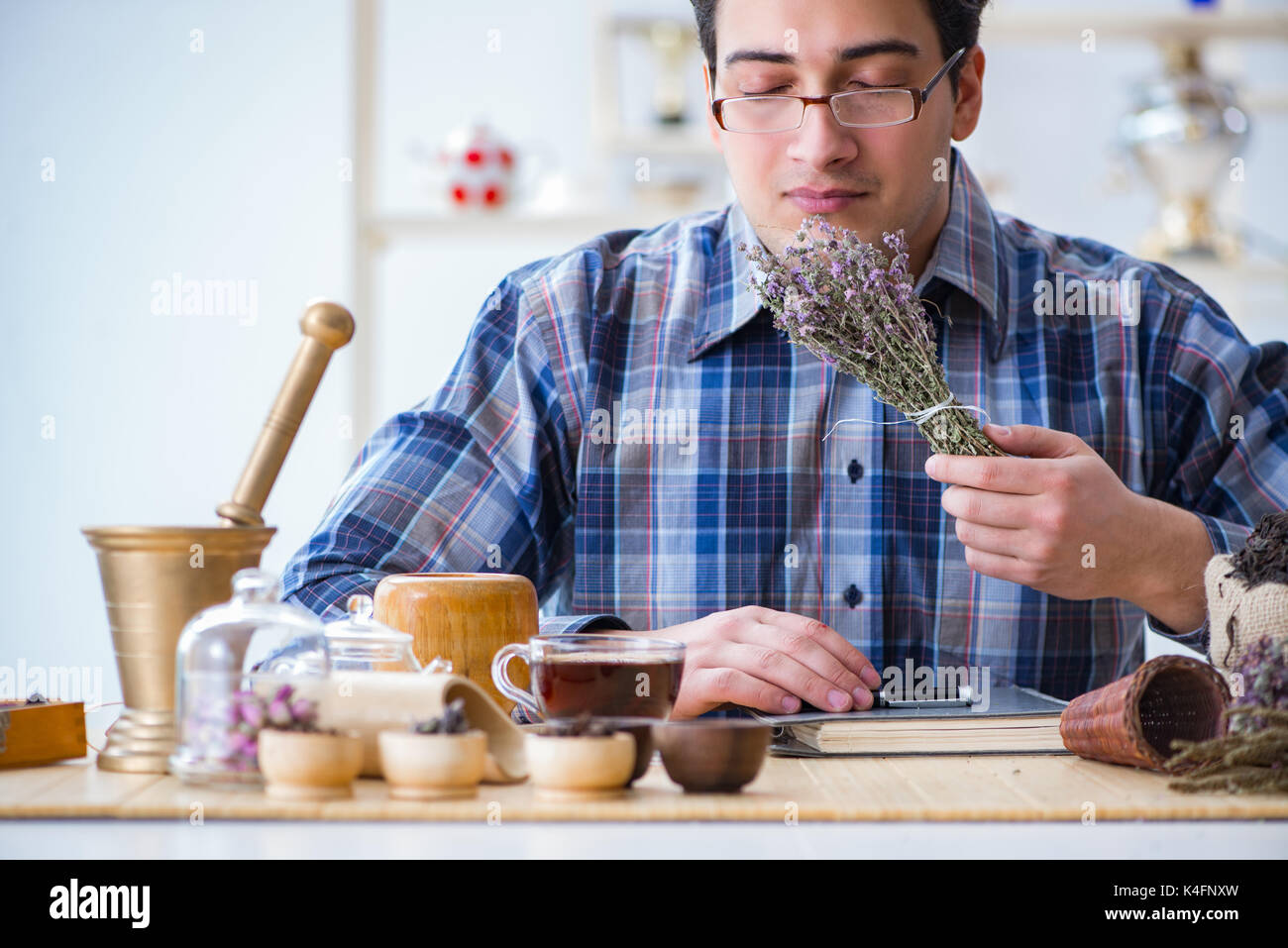 Tea expert brewing cup of drink hi-res stock photography and images - Alamy