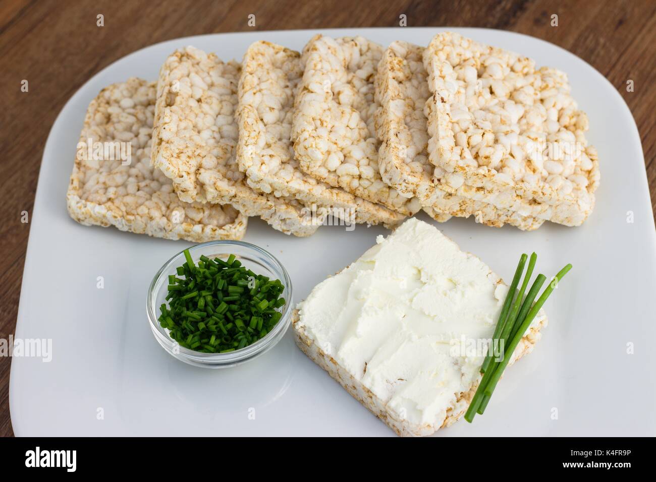 Rice cakes with cream cheese and chives Stock Photo - Alamy